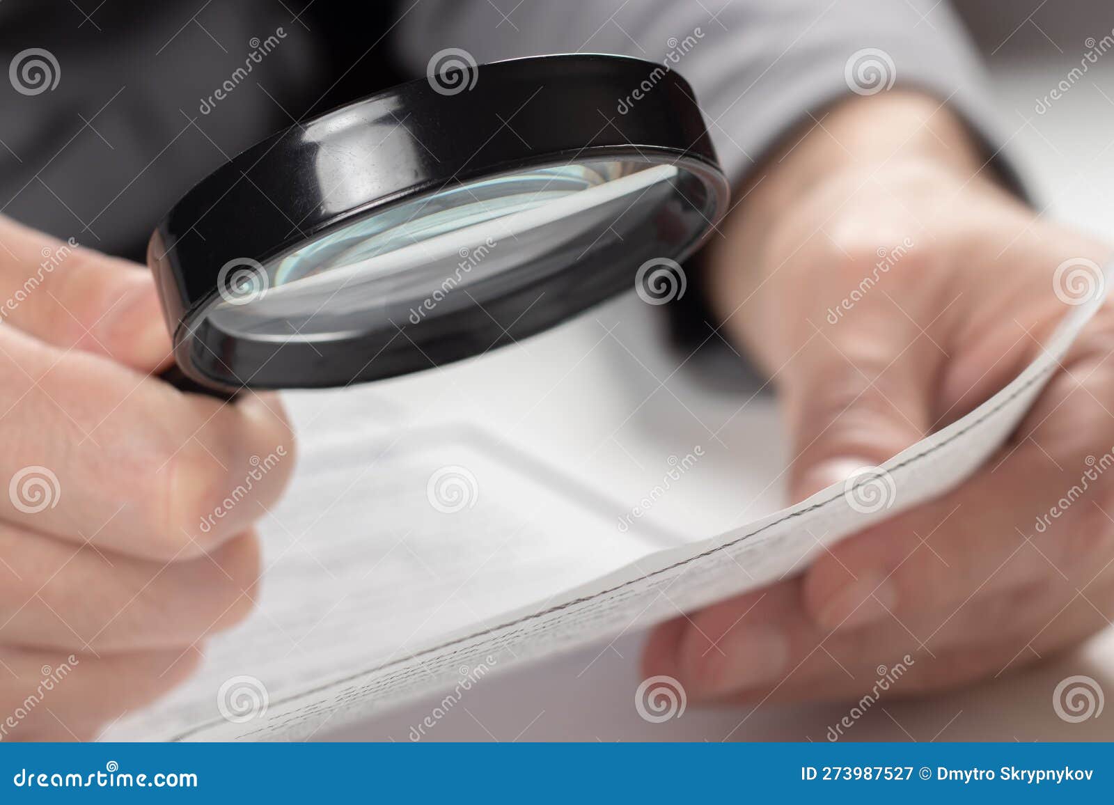 Man Looking through a Magnifying Glass To Documents Stock Image - Image ...