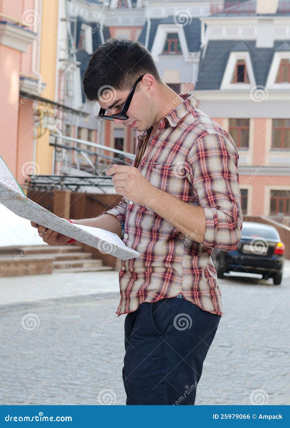 Man Looking at a Map in Town Stock Photo - Image of journey, traveller ...