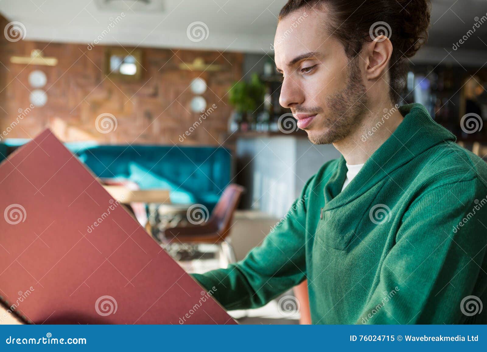 Man looking at menu stock image. Image of person, male - 76024715
