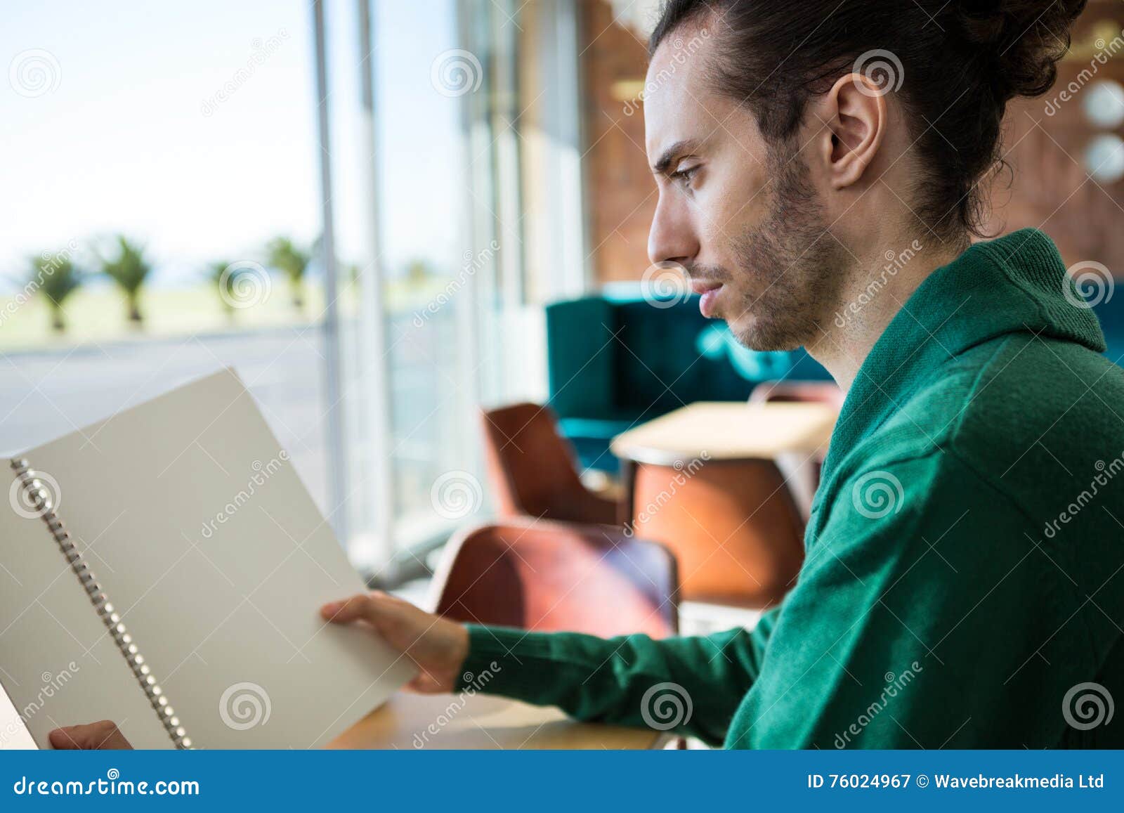 Man looking at menu stock image. Image of thinking, restaurant - 76024967