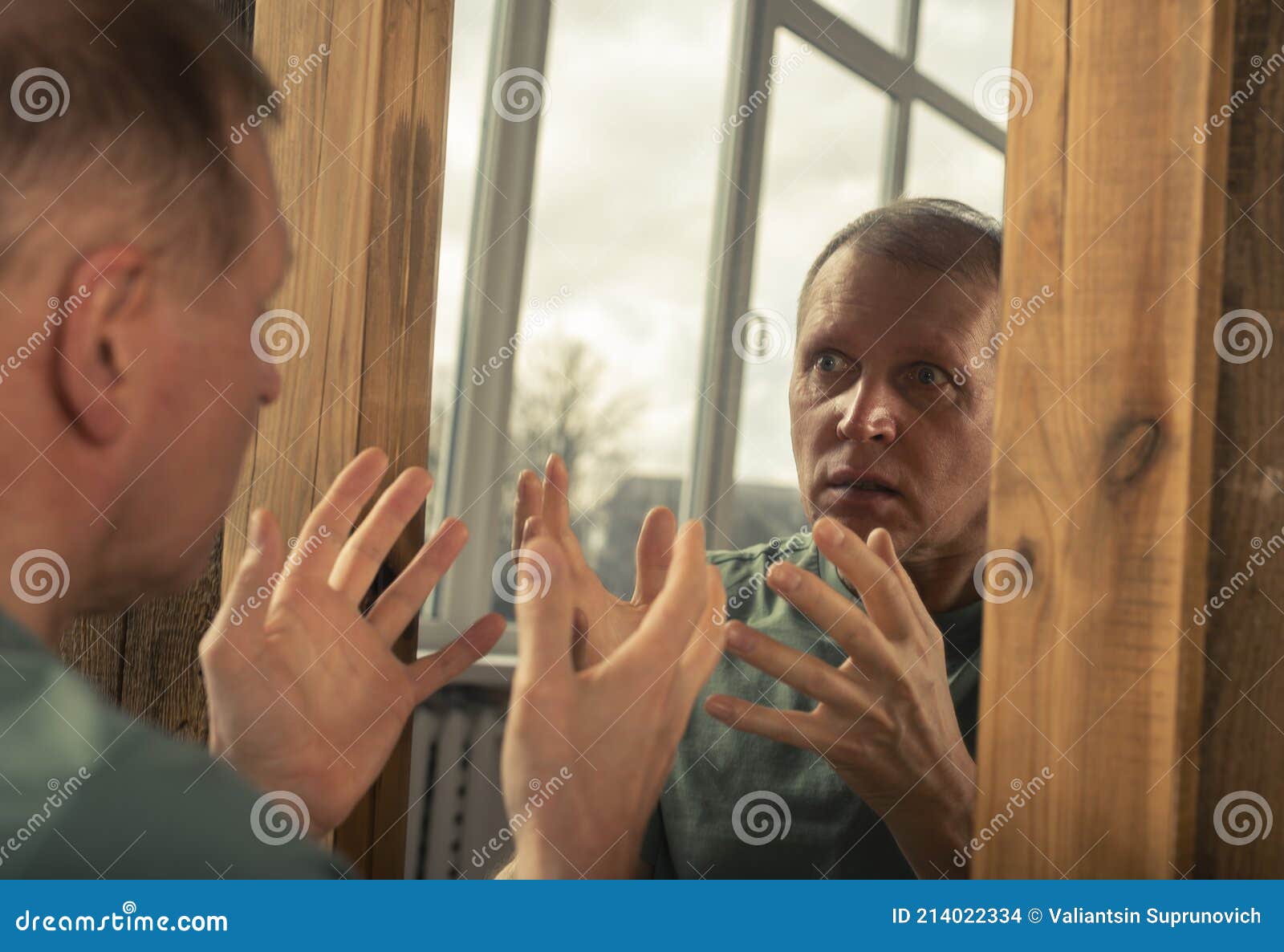 Man Looking in Mirror in Anger and Rage and Shouting at Him Self ...