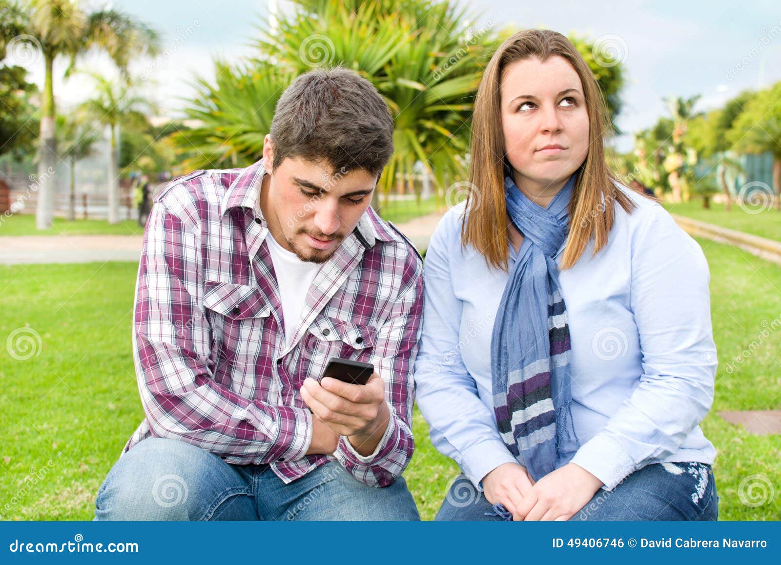 Man looking mobile phone stock photo. Image of couple - 49406746