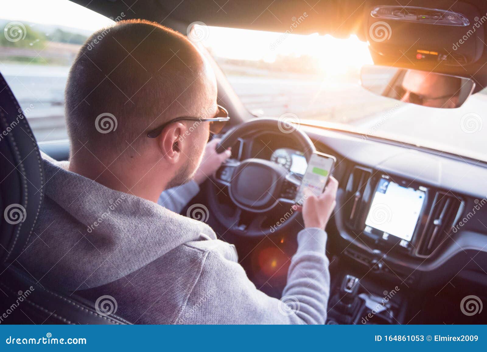 Man Looking at Mobile Phone while Driving a Car Stock Image - Image of ...