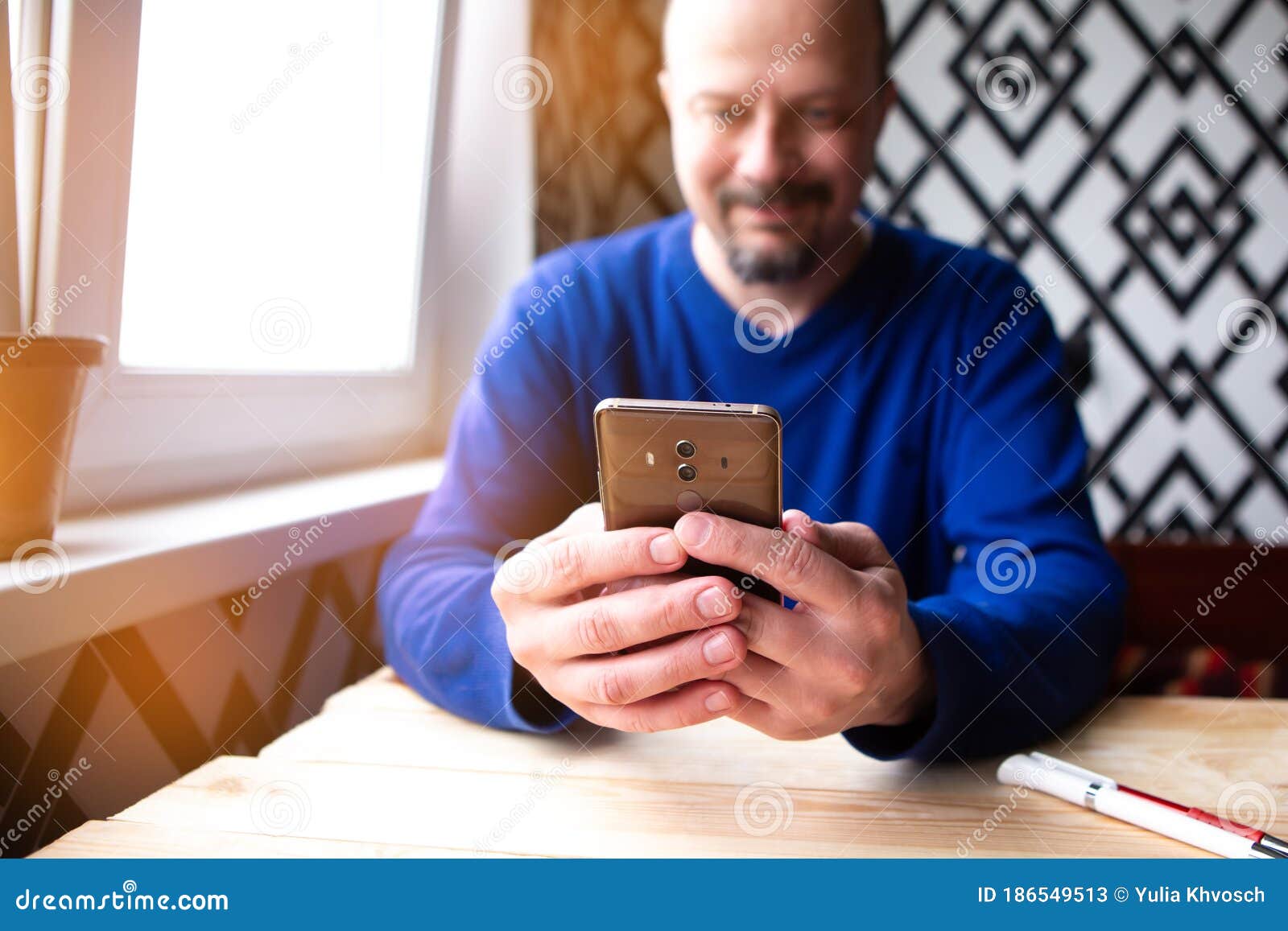 Man Looking at Mobile Phone Stock Image - Image of mobile, confident ...