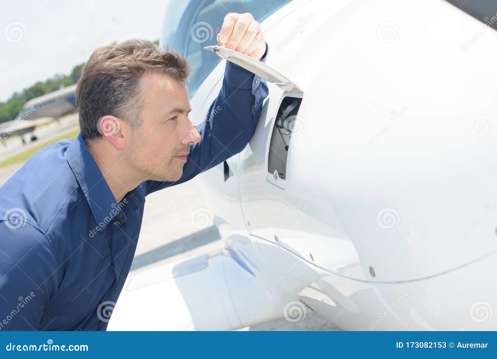 Man Looking through Open Flap on Aircraft Stock Image - Image of flap ...