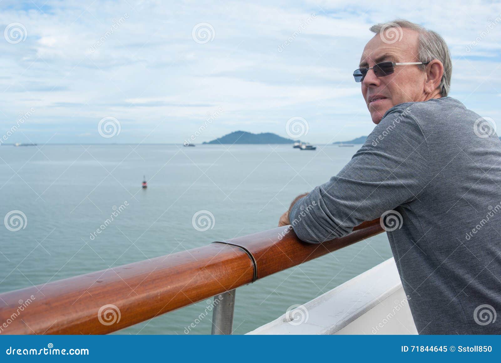 Man looking out to sea stock image. Image of tourism - 71844645