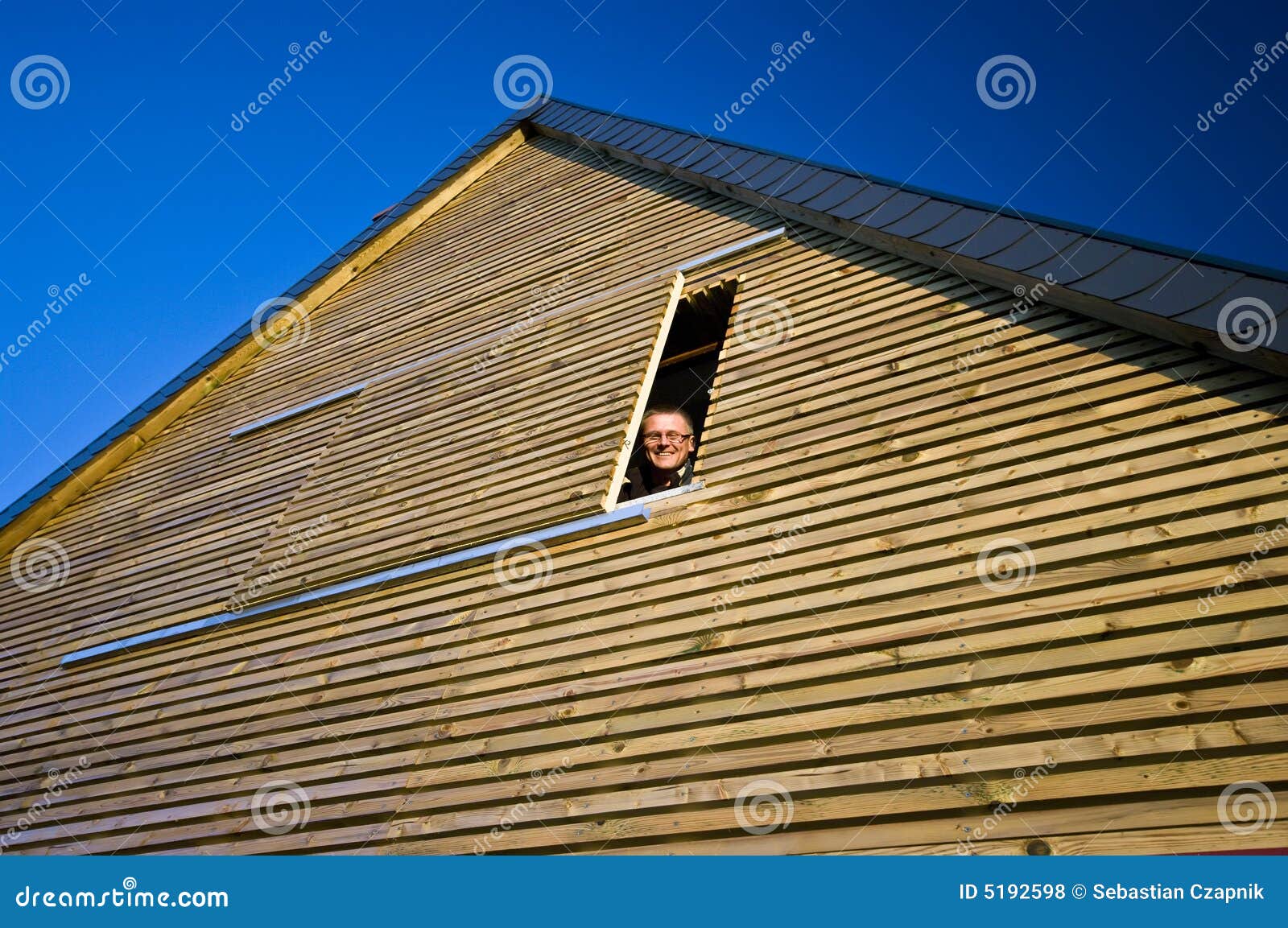 Man looking out of window stock photo. Image of building - 5192598