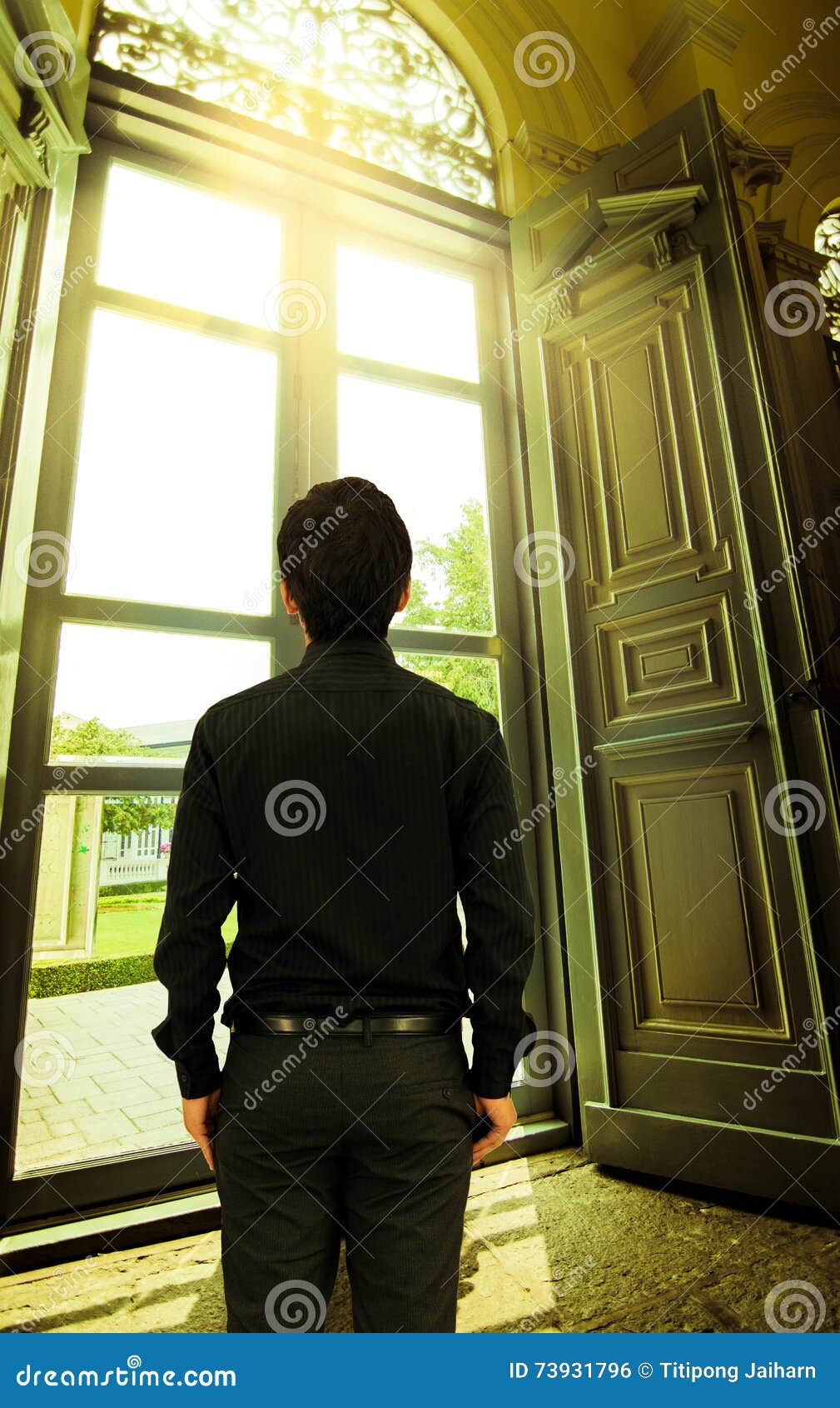 Man Looking Out Window in Golden Sunlight in Palace. Stock Photo ...