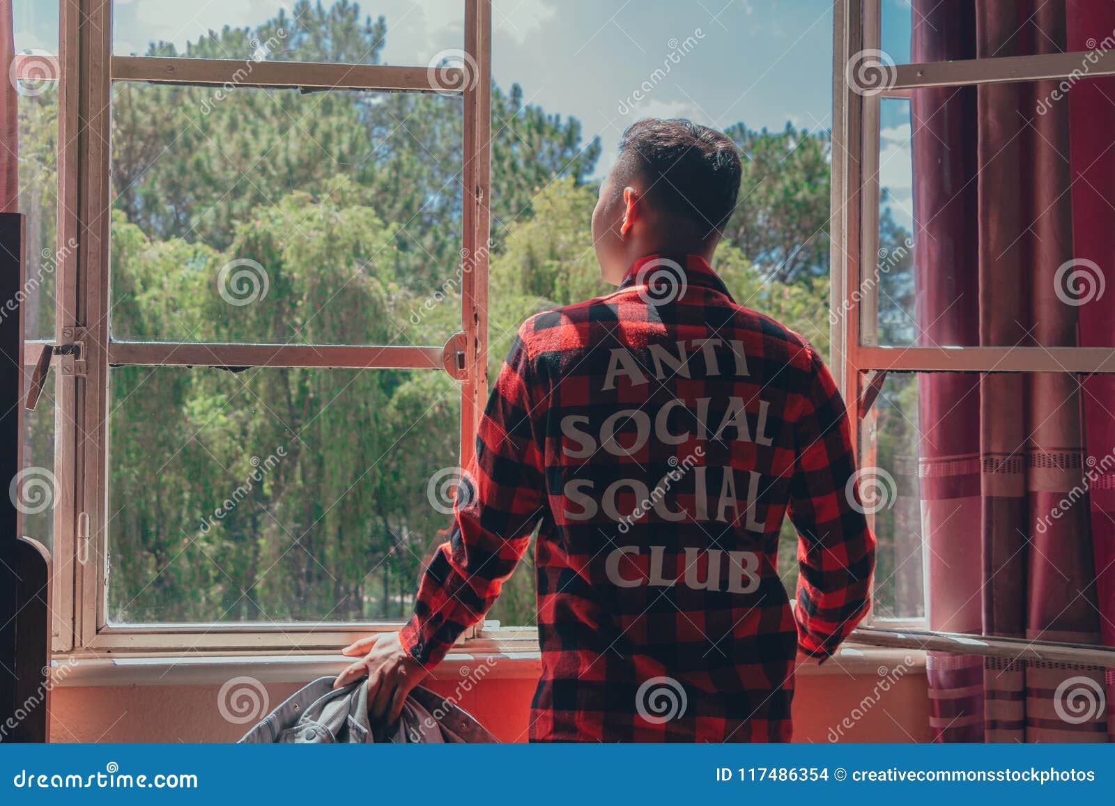 Man Looking Outside Window Picture. Image: 117486354