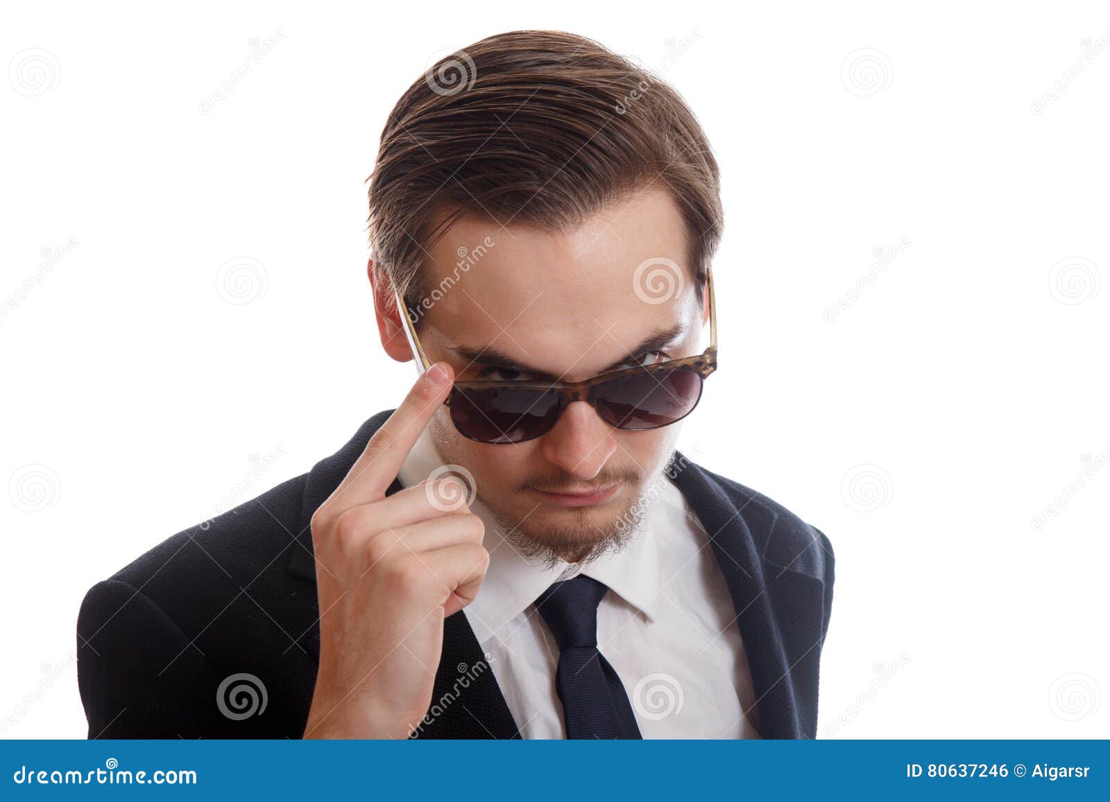 Man Looking Over His Glasses Stock Photo - Image of standing, young ...