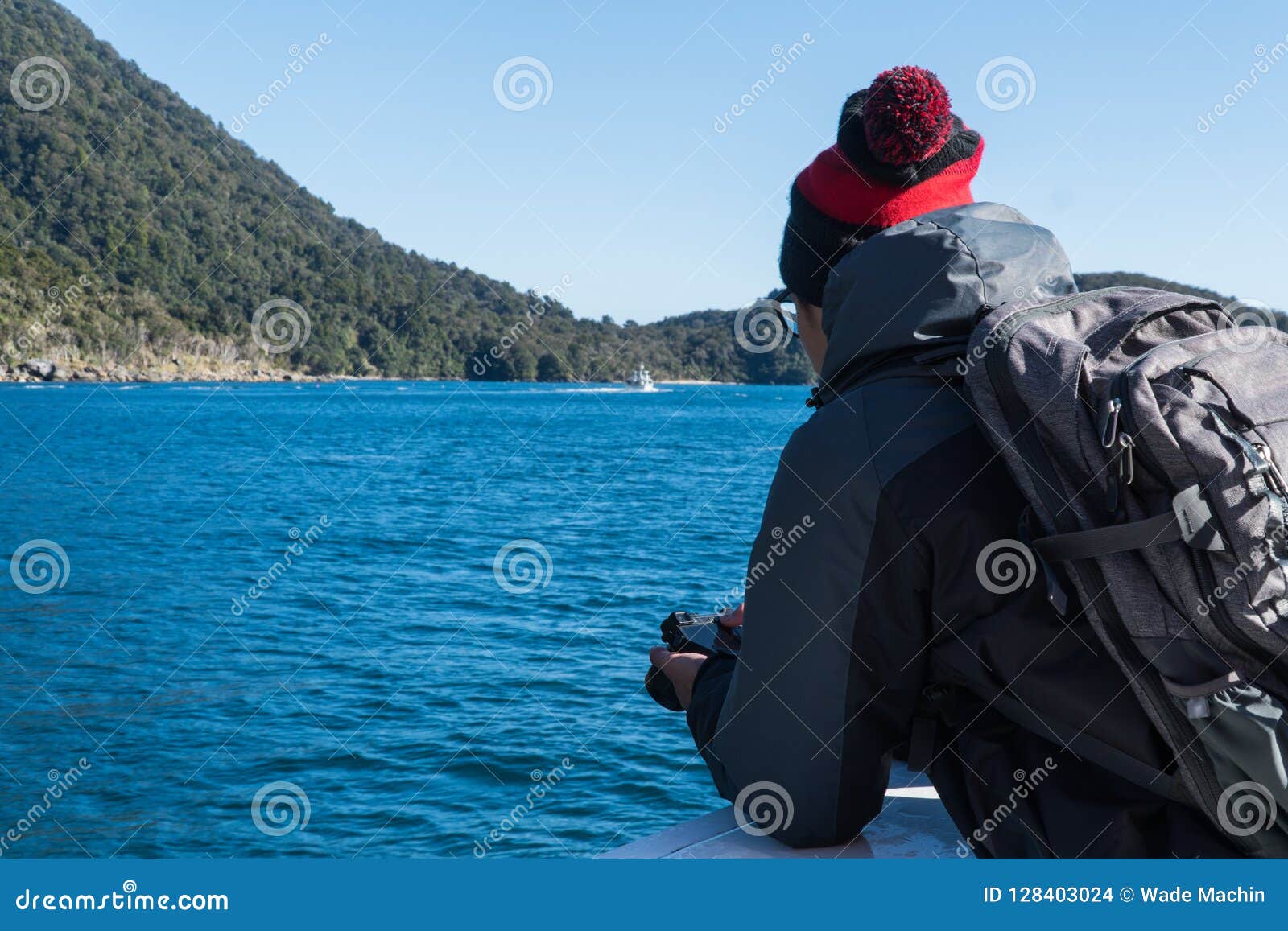 Man Looking Over the Side of a Boat in New Zealand with His Camera ...
