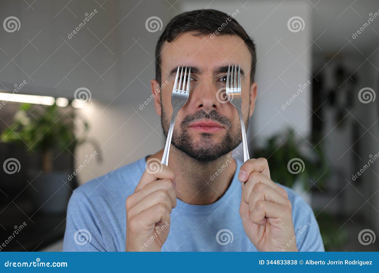 Man Looking through Pair of Forks Stock Photo - Image of joke, hostage ...