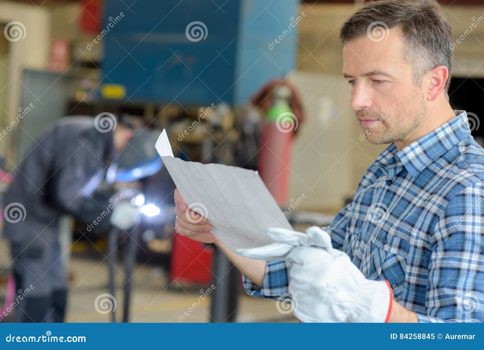 Man looking at paper stock image. Image of design, male - 84258845