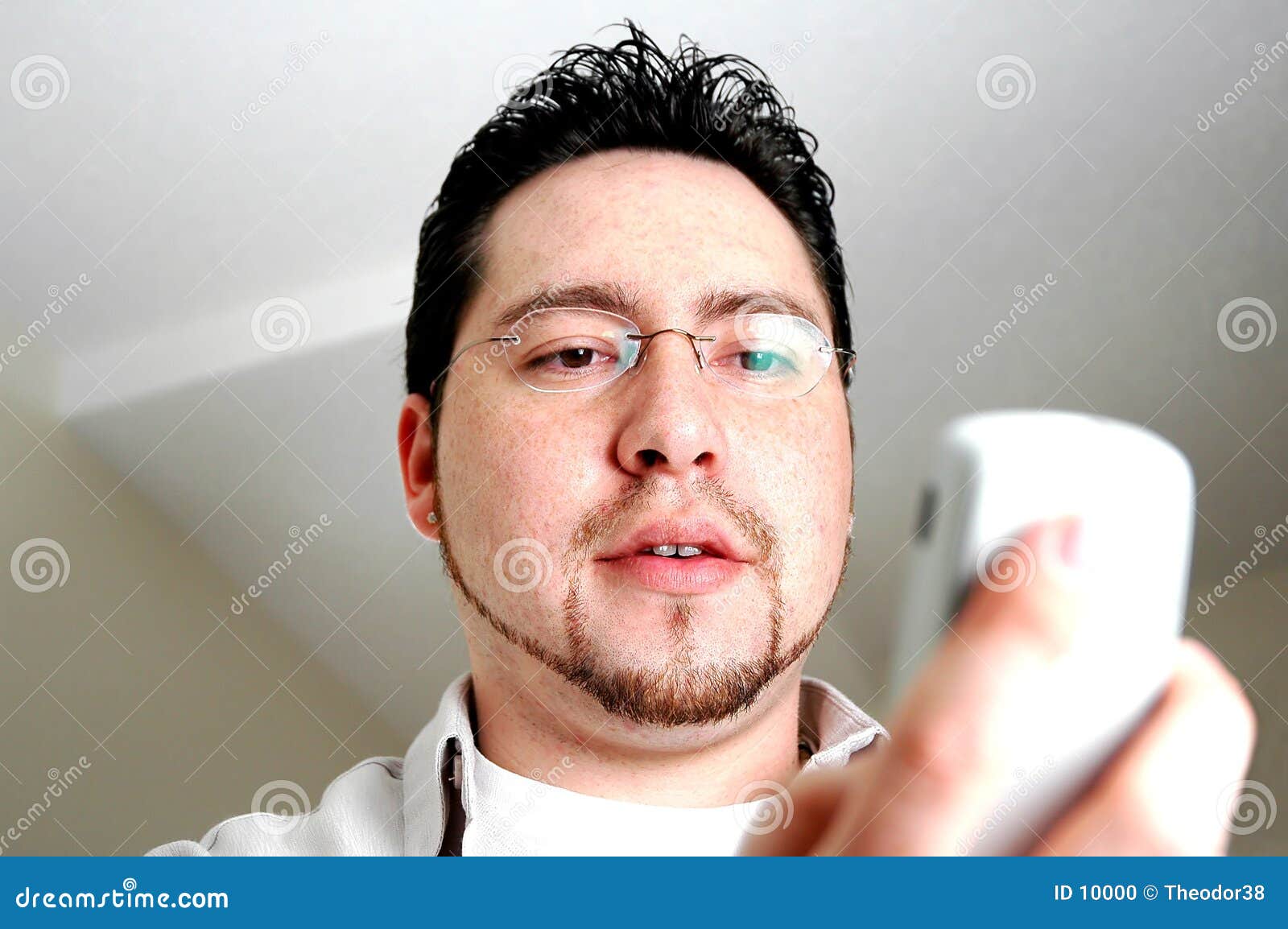 Man looking at phone stock photo. Image of time, hand, jeans - 10000