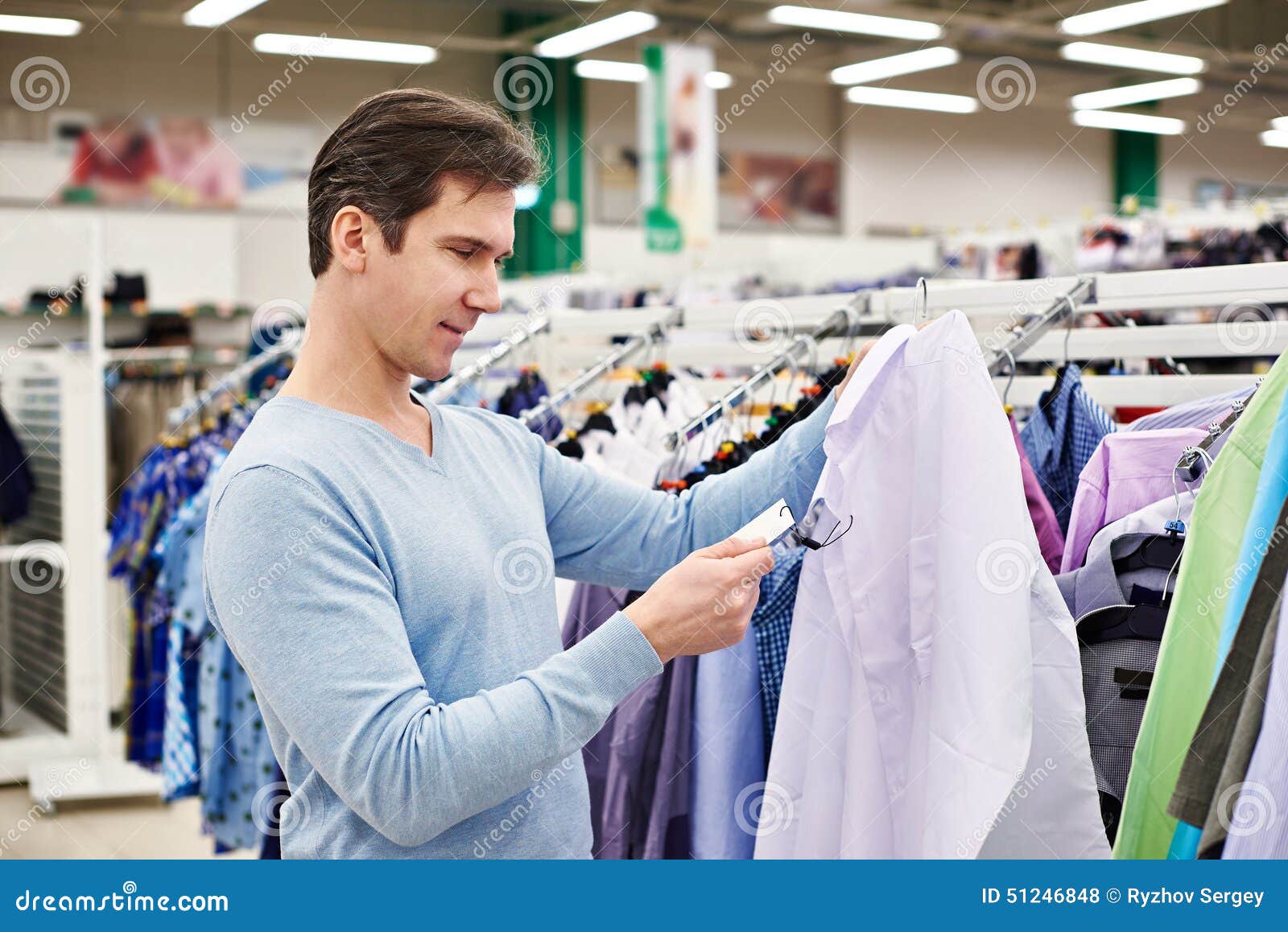 Man Looking at Price Tag of Goods Stock Photo - Image of retail, modern ...