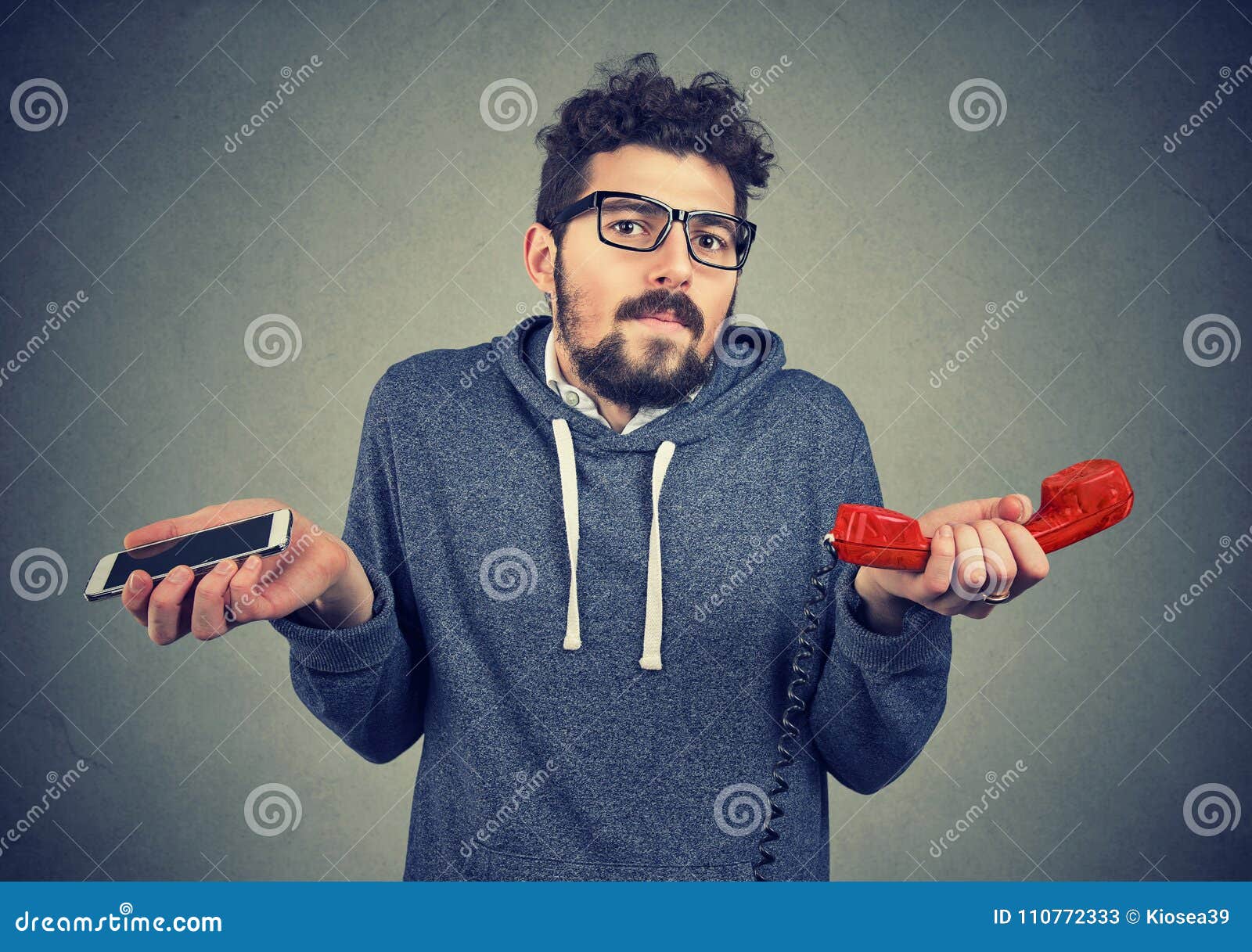 Man Looking Puzzled about Old Fashioned and Contemporary Gadgets. Stock ...