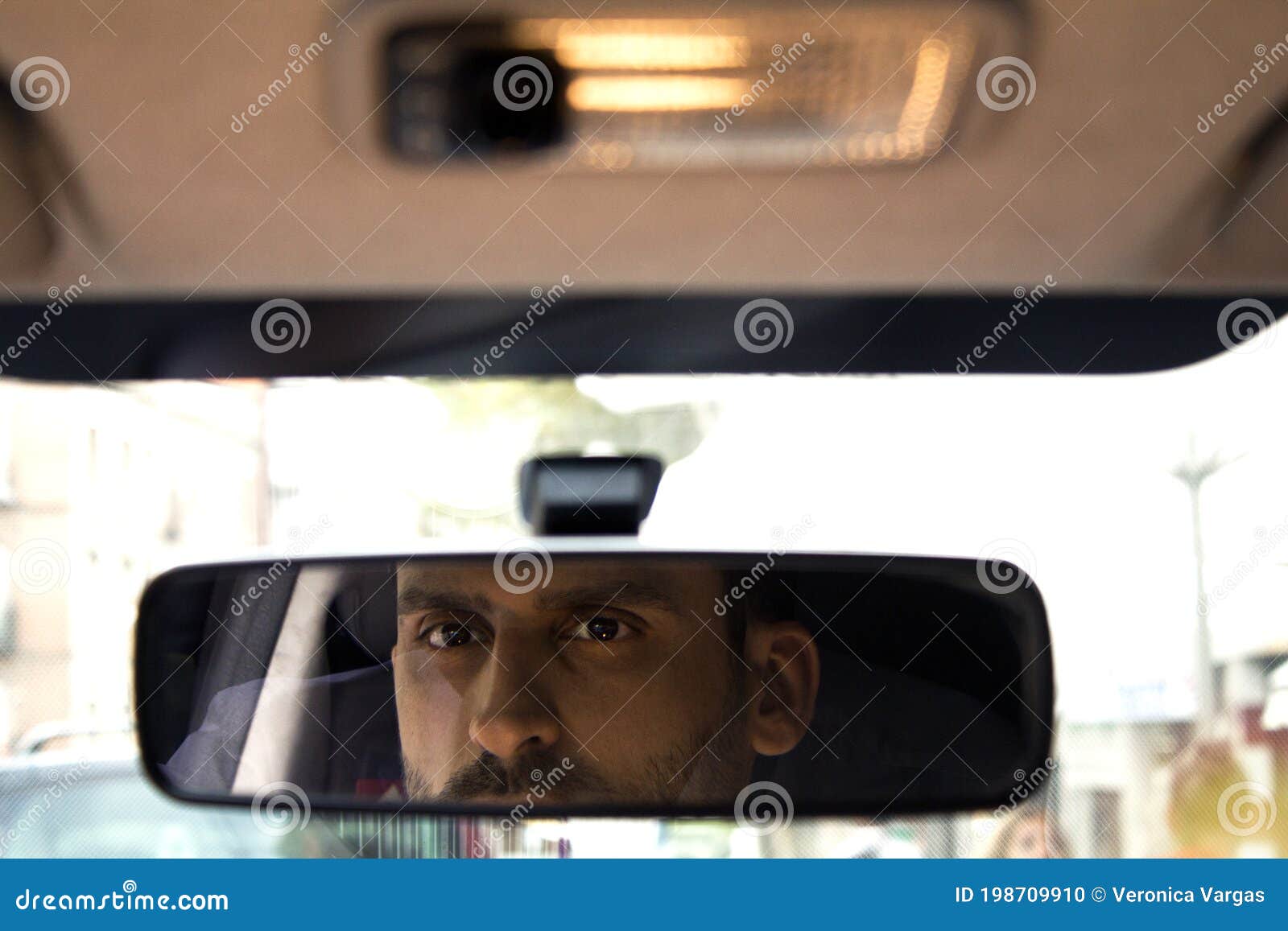 Man Looking in the Rear View Mirror of the Car Stock Photo - Image of ...