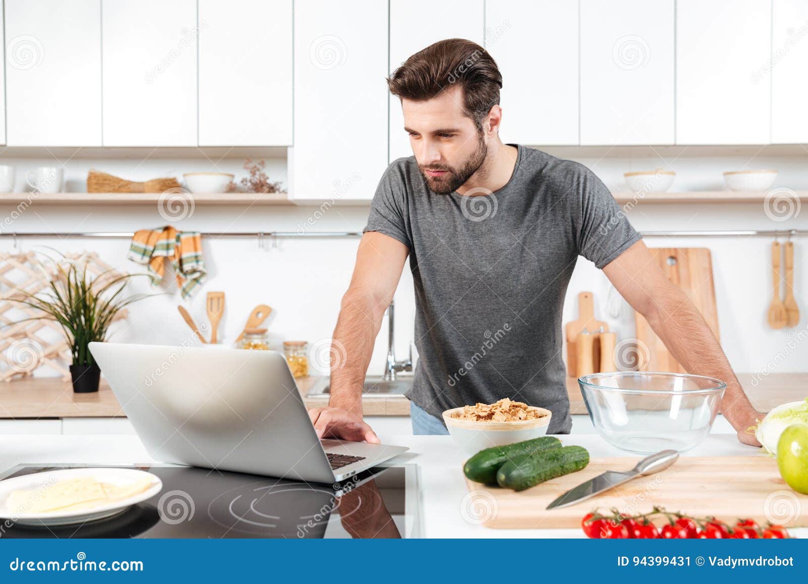 Man Looking Recipe on Laptop in Kitchen at Home Stock Image - Image of ...