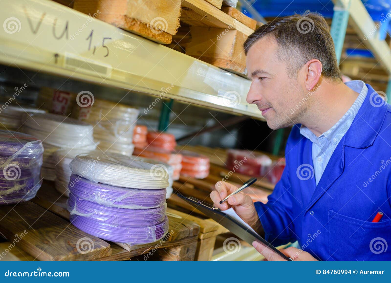 Man Looking at Reference Product Stock Photo - Image of product ...