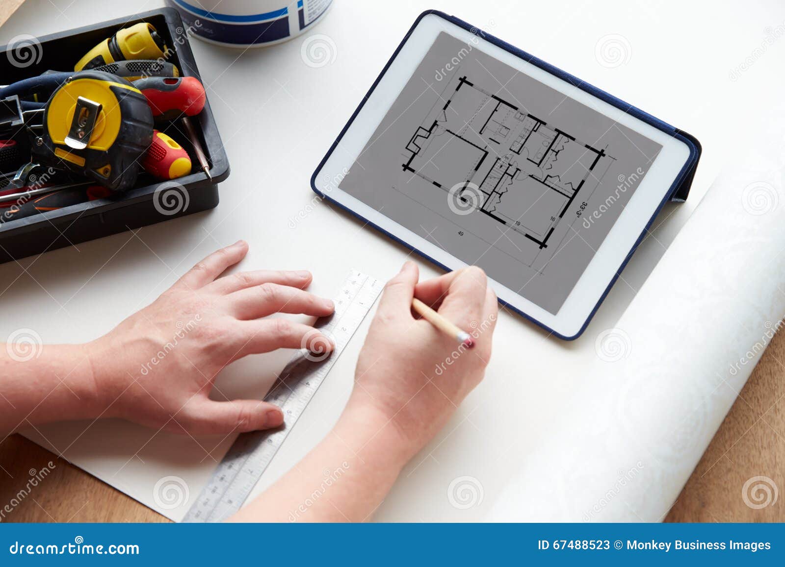 Man Looking at Room Plans on Digital Tablet Stock Image - Image of ...