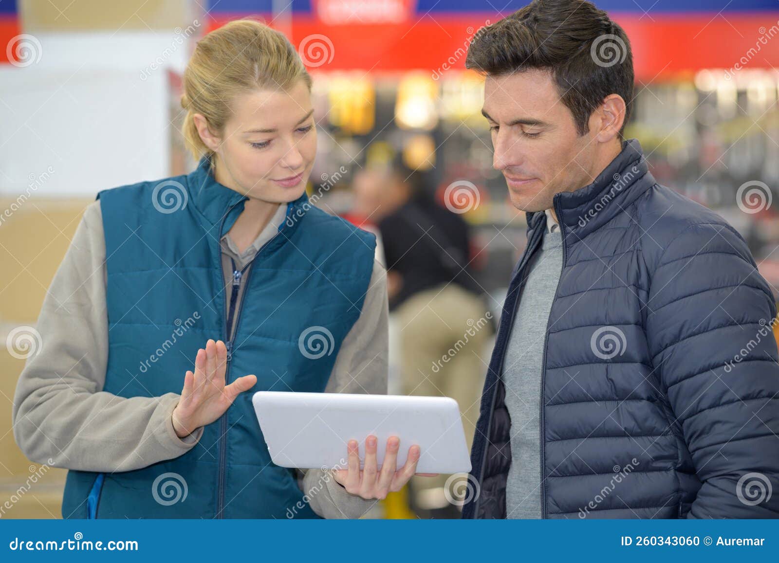 Man Looking and Salesman Using Tablet Computer in Store Stock Photo ... Man Looking and Salesman Using Tablet Computer in Store Stock Photo ...