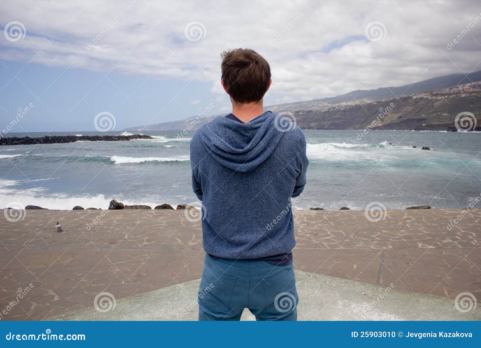 Man looking at the sea stock photo. Image of space, independence - 25903010