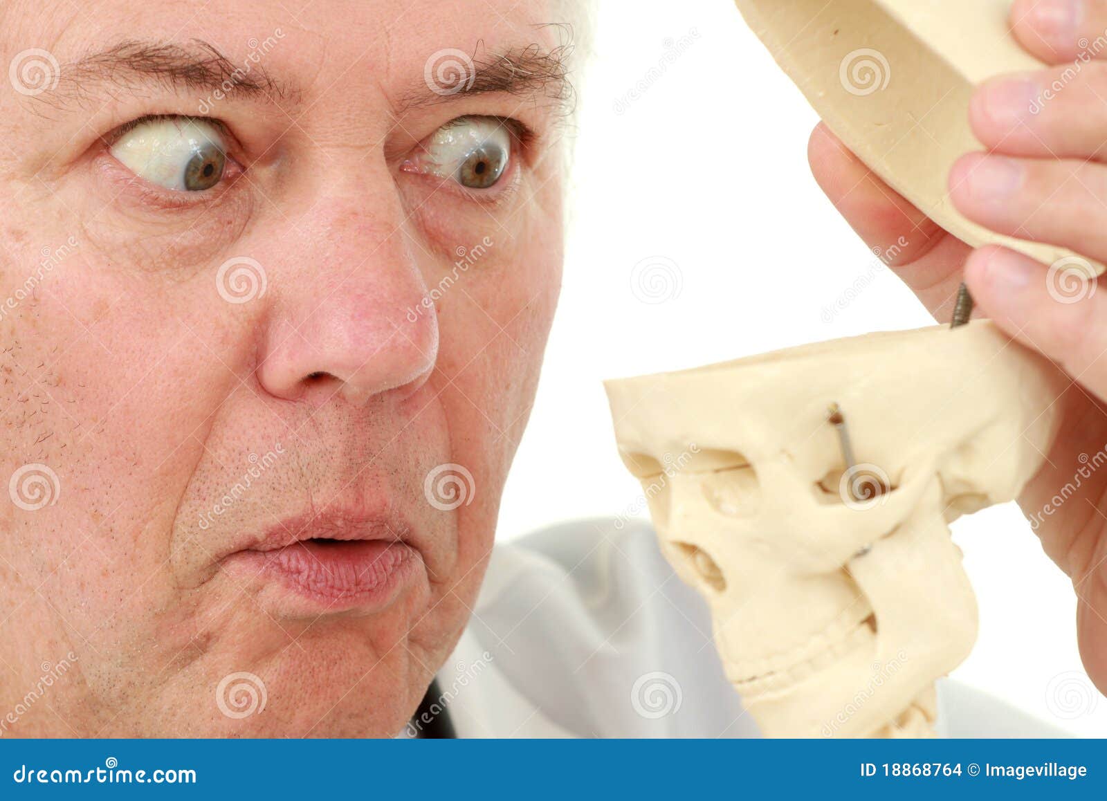 Man looking into the skull stock photo. Image of male - 18868764