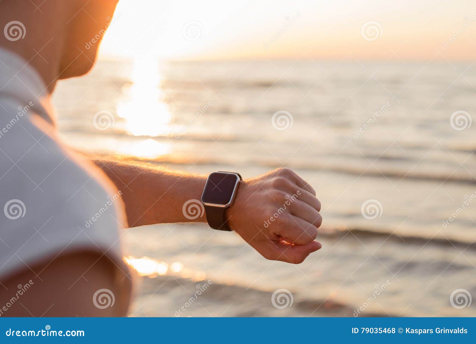 Man looking at smartwatch stock photo. Image of gadget - 79035468