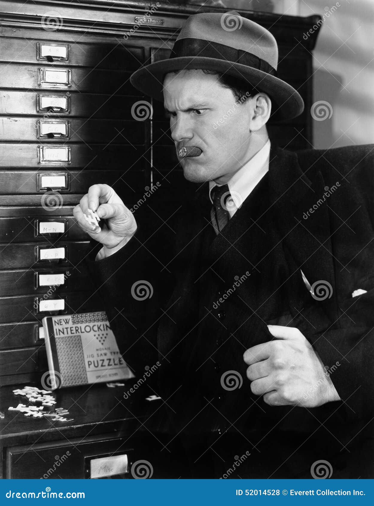 Man Looking Sternly at a Piece of Puzzle Stock Photo - Image of concern ...
