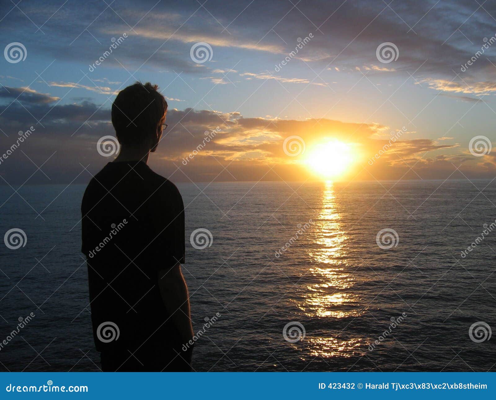 Man looking at sunset stock photo. Image of shore, late - 423432