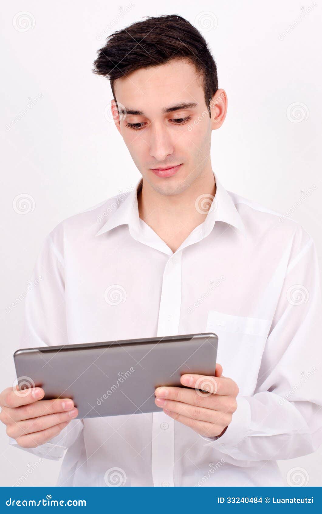Man looking at the tablet. stock photo. Image of plain - 33240484