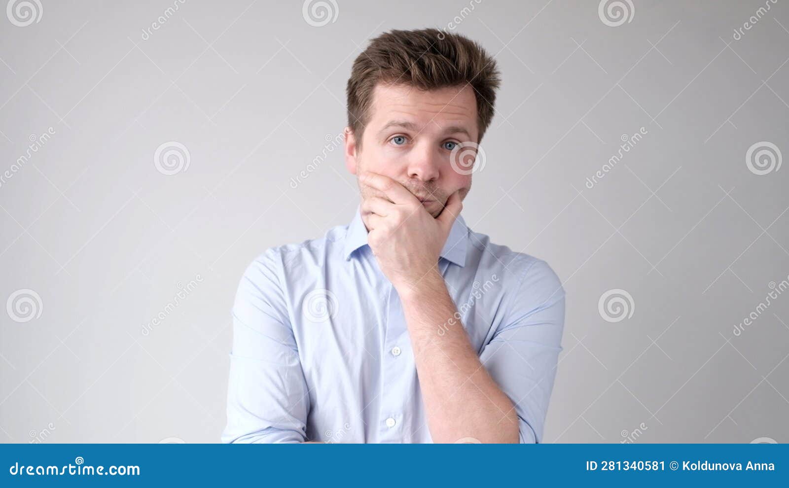 Man is Looking Thoughtfully into the Camera, Perplexed by a Difficult ...