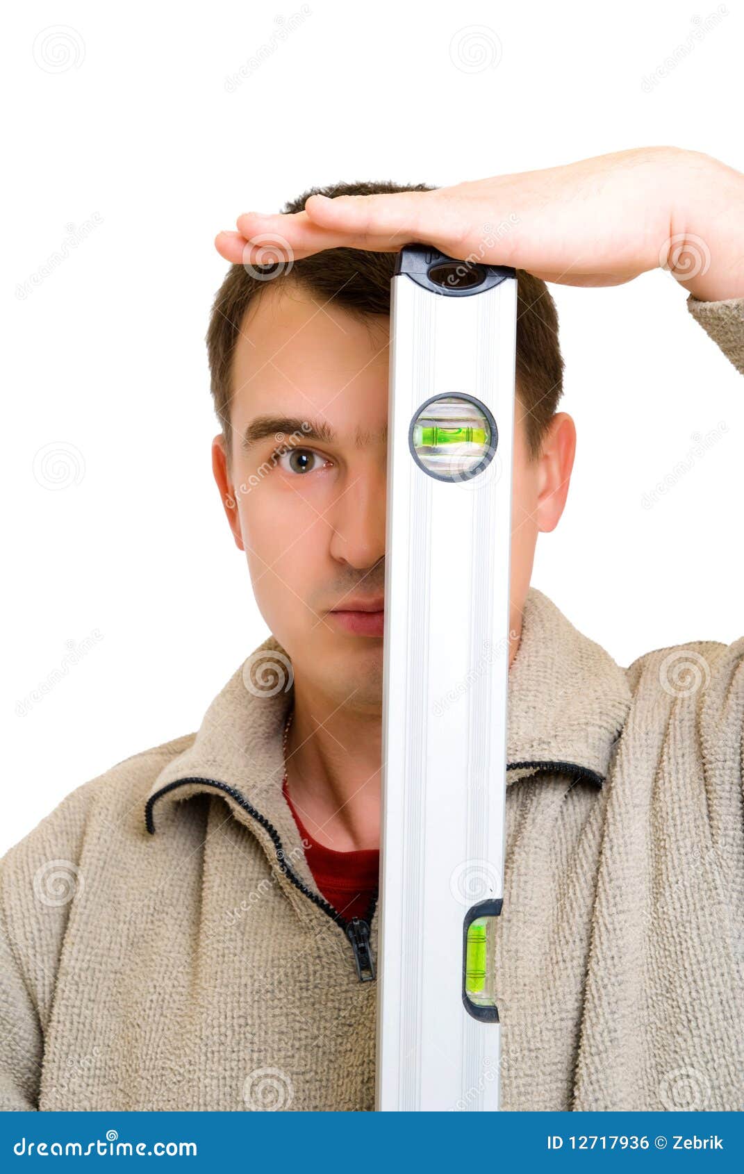 Man looking to level tool stock photo. Image of equipment - 12717936