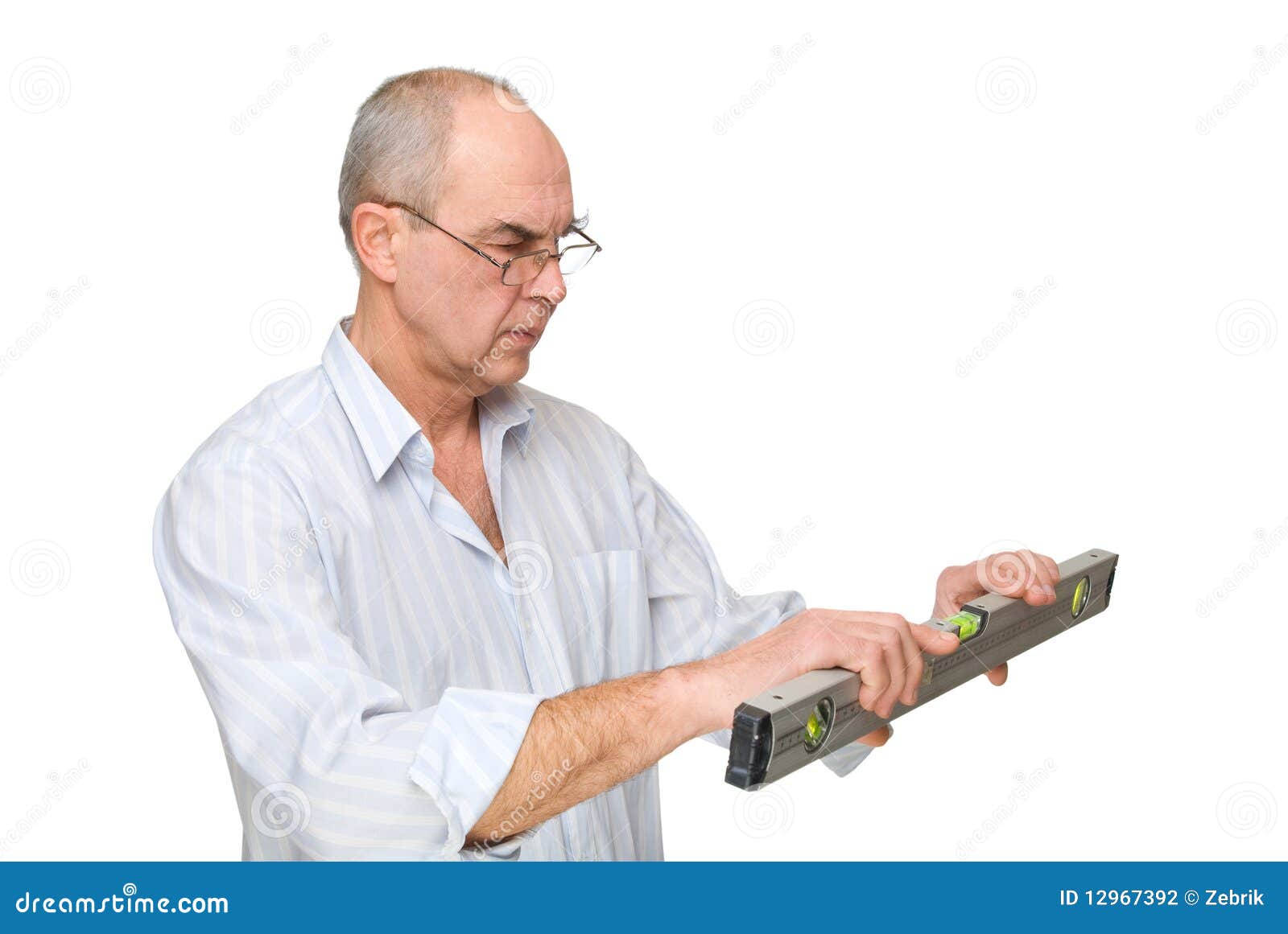 Man looking to level tool stock photo. Image of construction - 12967392