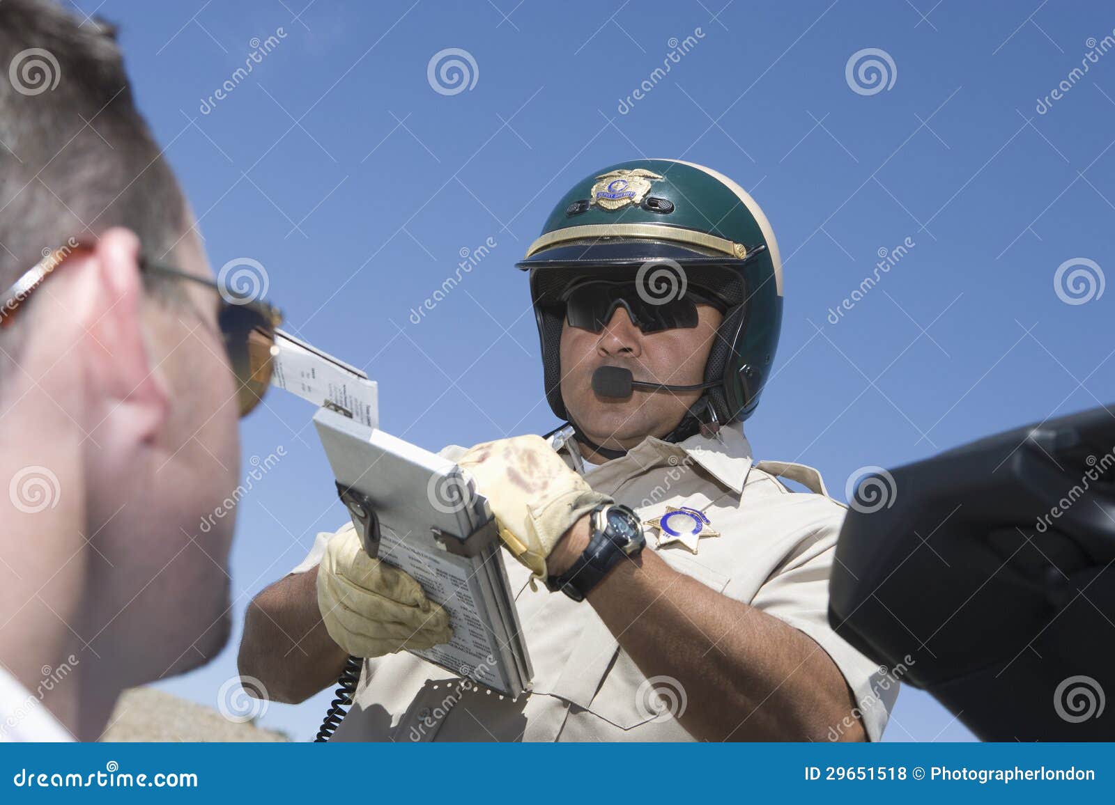 Man Looking at Traffic Cop Holding Clipboard Stock Photo - Image of ...