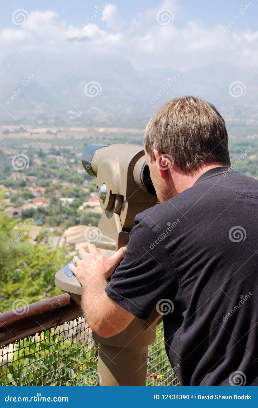 Man Looking through View Telescope. Vertical Stock Stock Photo - Image ...
