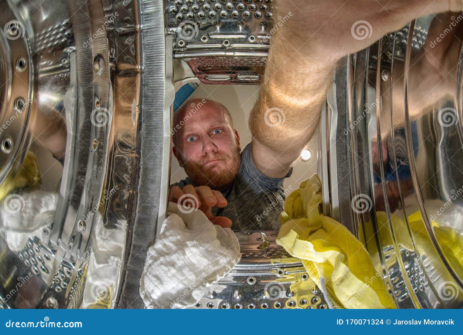Man Looking into the Washing Machine Stock Photo - Image of closeup ...