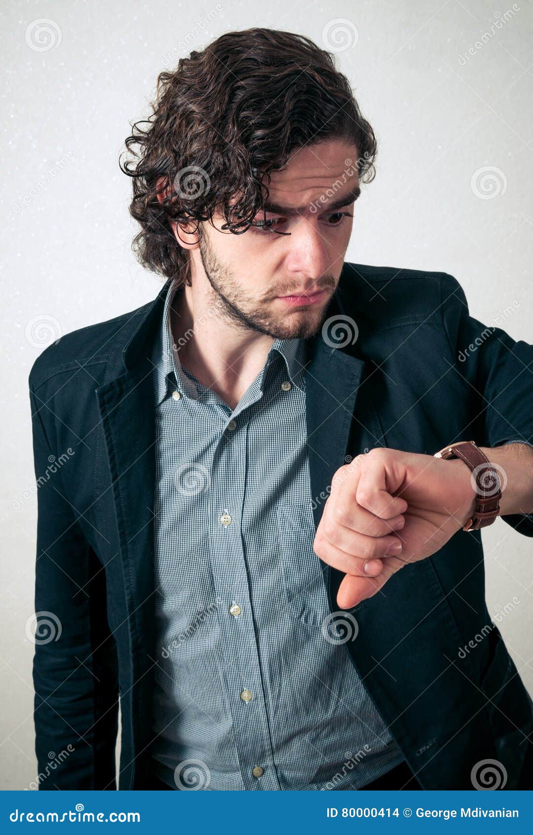 Man looking on watch stock photo. Image of phone, male - 80000414