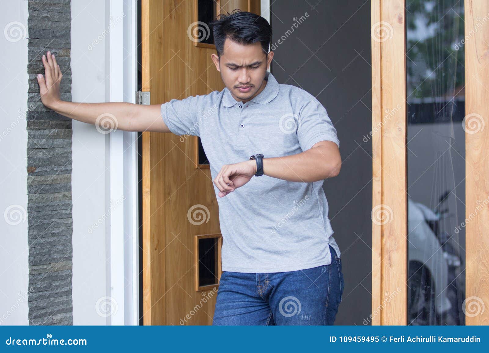 Man looking watch stock image. Image of standing, handsome - 109459495