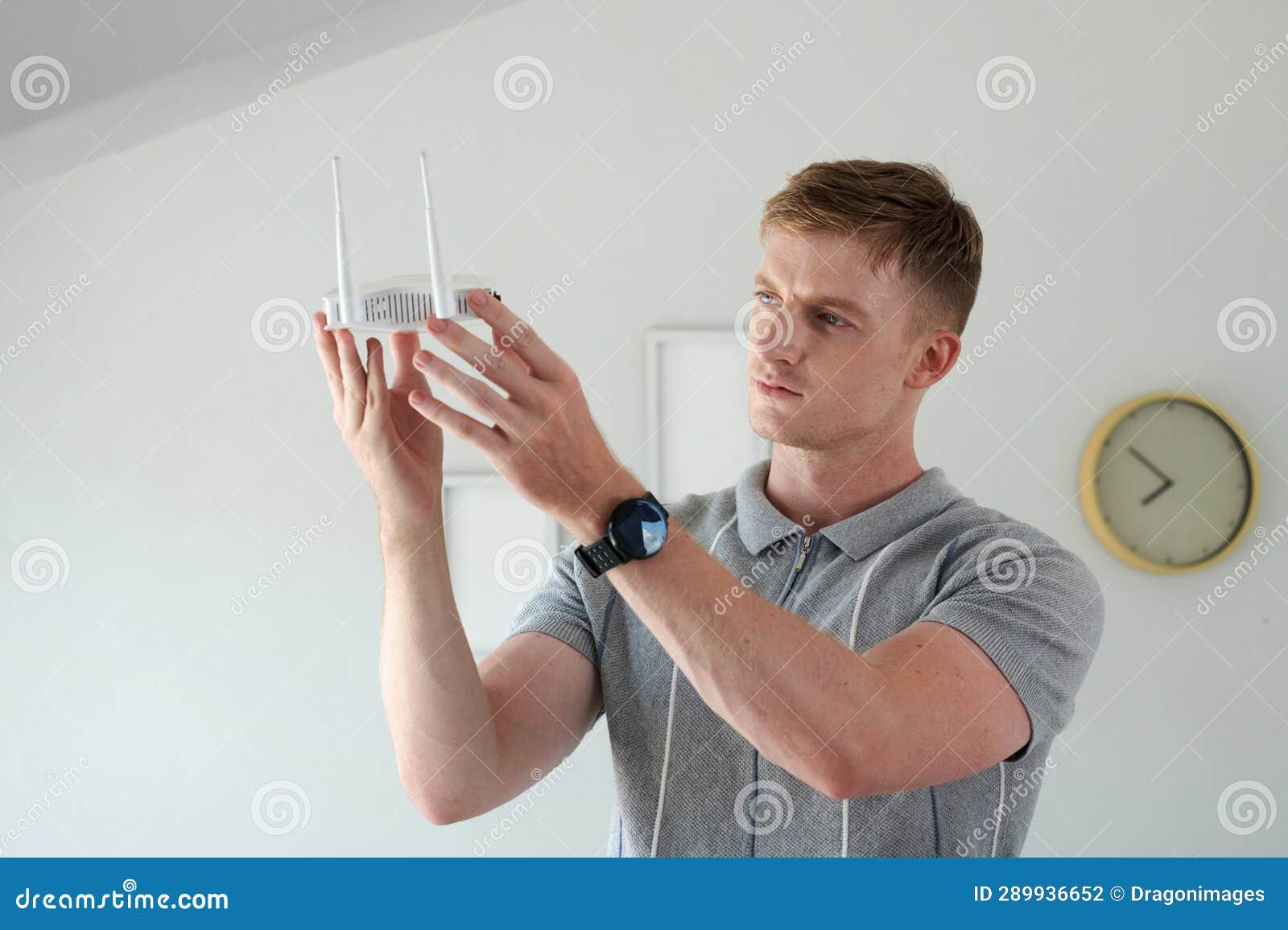 Man Looking at WIFI Router stock photo. Image of wifi - 289936652
