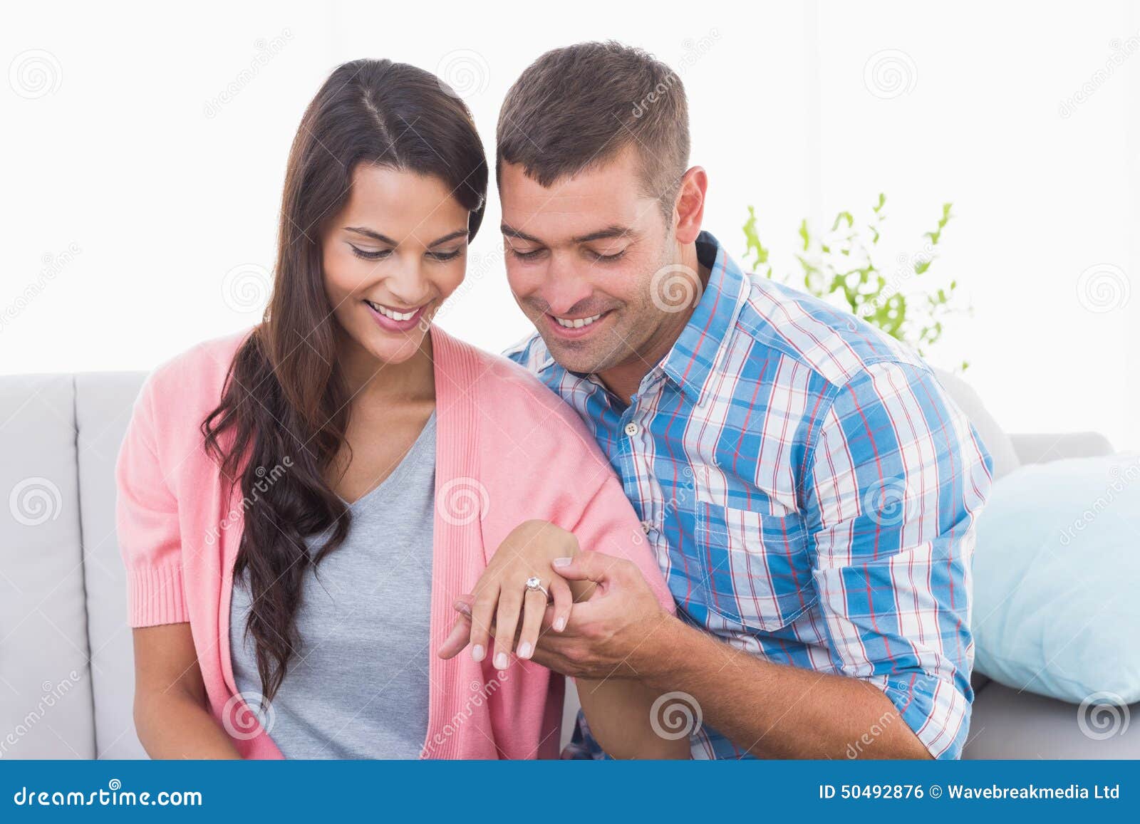 Man Looking at Womans Engagement Ring Stock Photo - Image of engagement ...