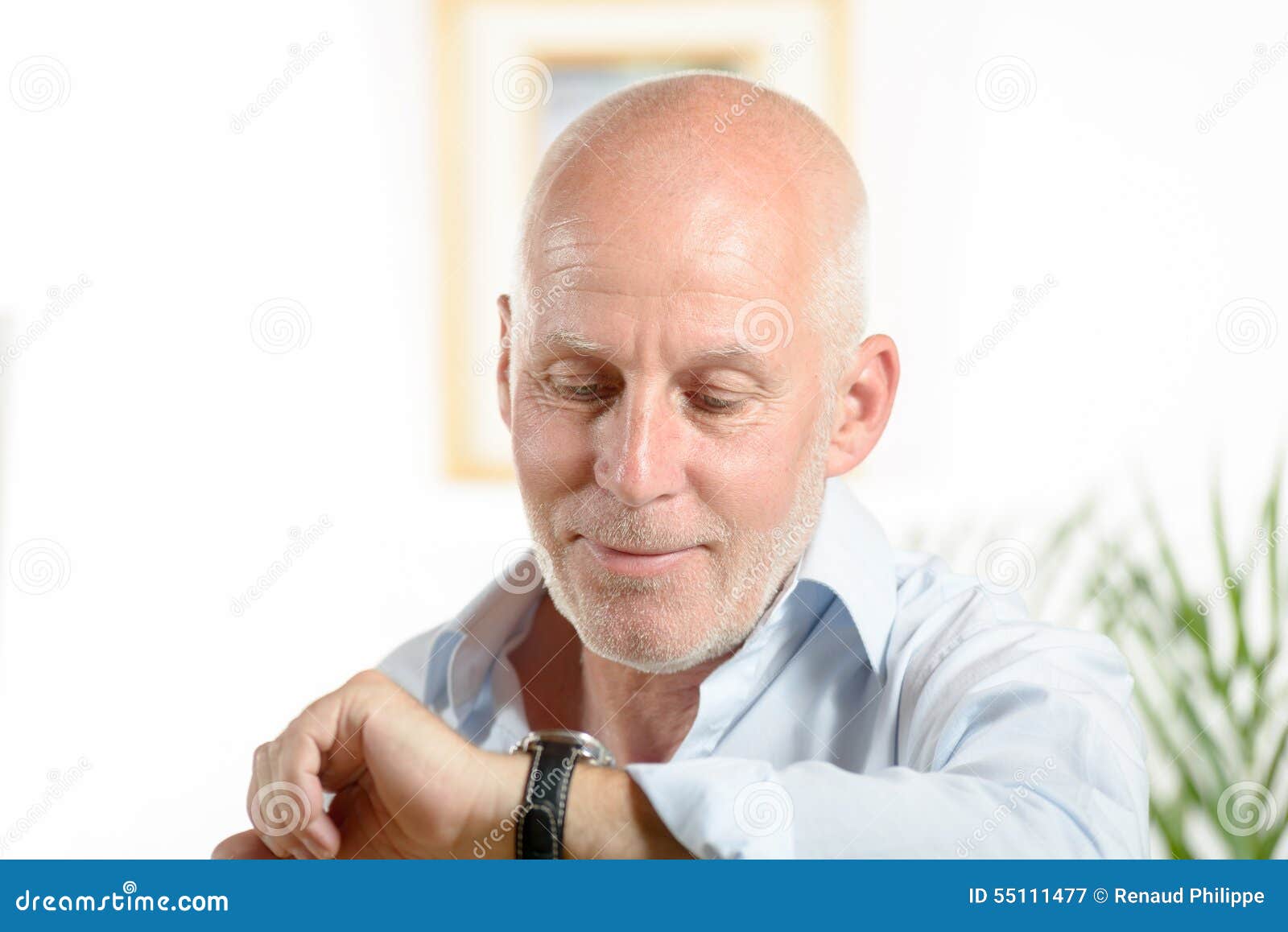 A man looks at his watch stock image. Image of corporate - 55111477