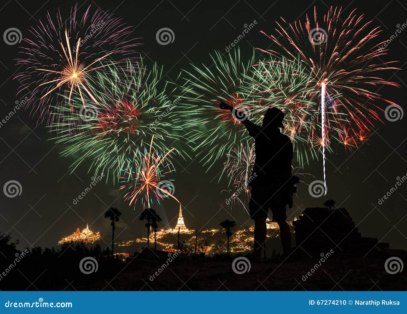The Man Looks Holiday Fireworks in the Evening Sky Stock Photo - Image ...