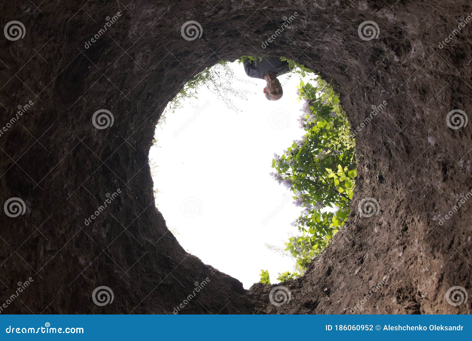 Man Looks into a Huge Pit. View from the Bottom of Pit Stock Photo ...
