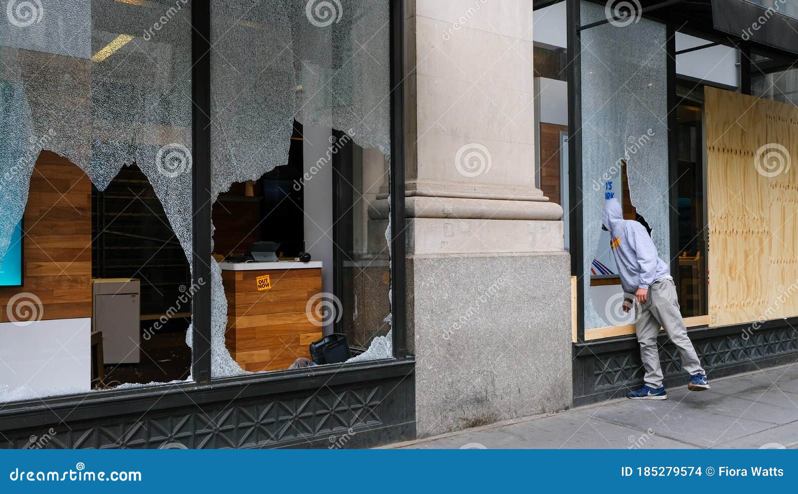 A Man Looks Inside a Vandalized Store Editorial Stock Image - Image of ...