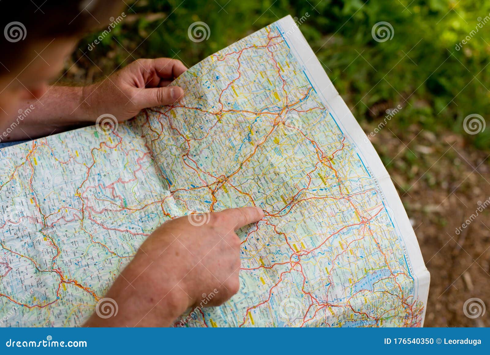 A man looks at the map. stock photo. Image of travel - 176540350