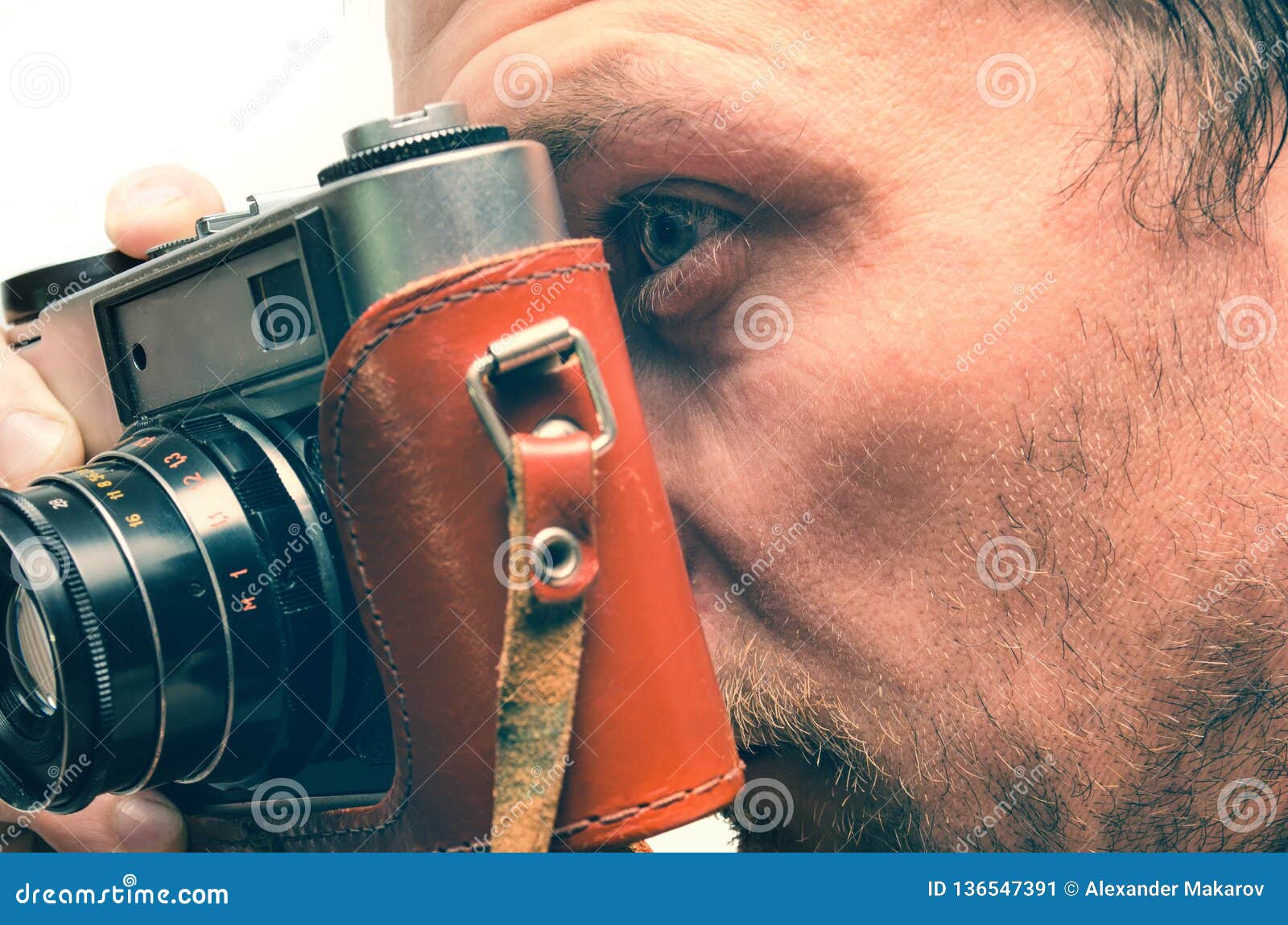 A man uses an old camera stock image. Image of lens - 136547391