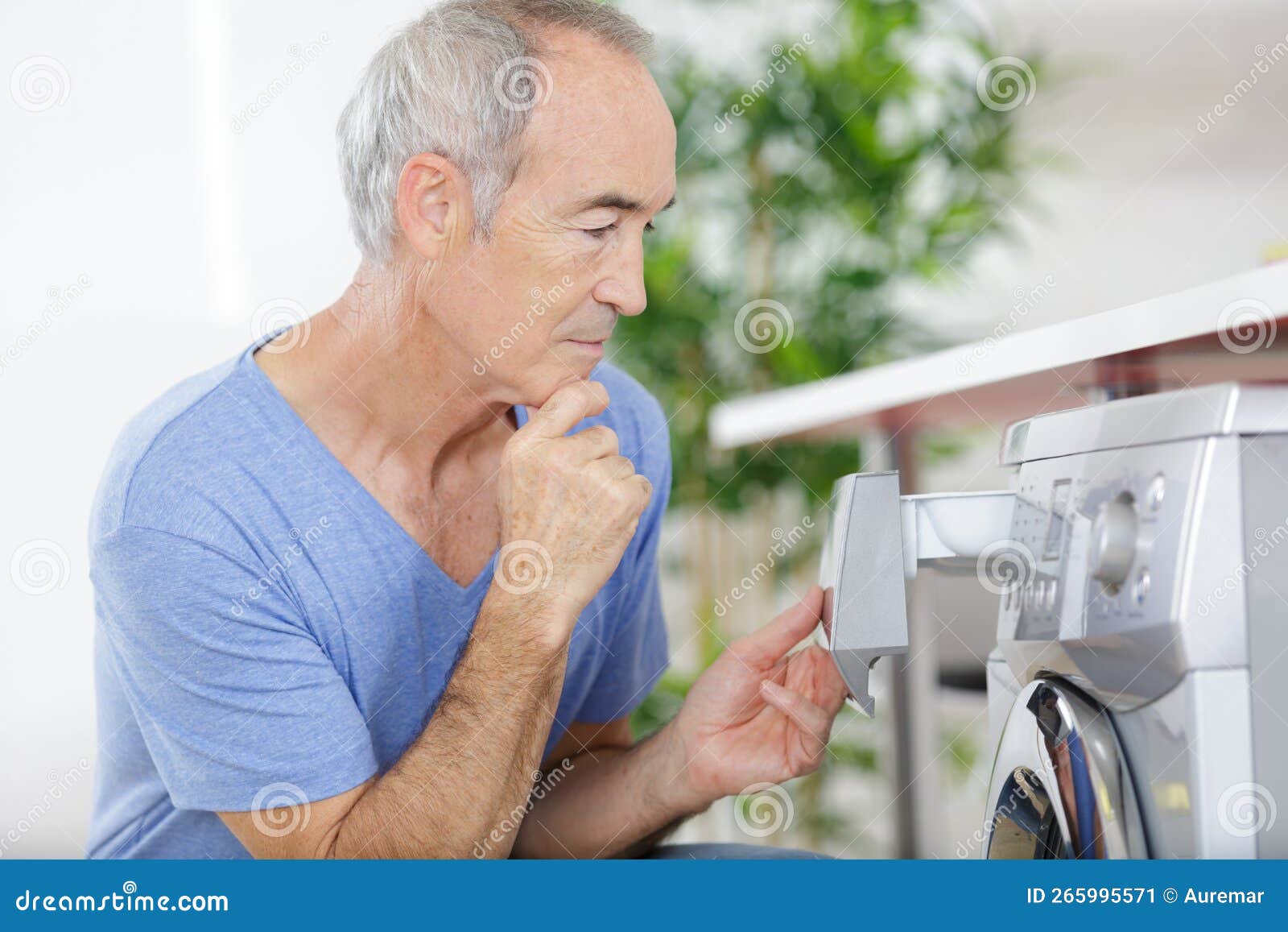 Man Looks at Washing Machine Stock Image - Image of appliance, senior ...