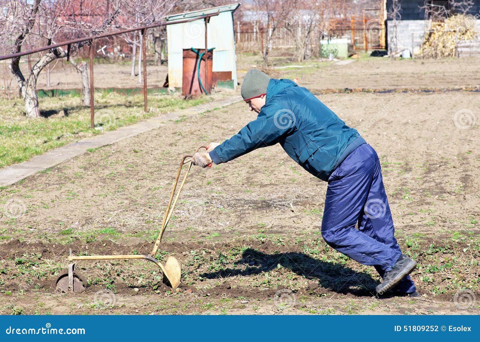 Man Loosens the Ground Using a Plow Stock Photo - Image of metal ...