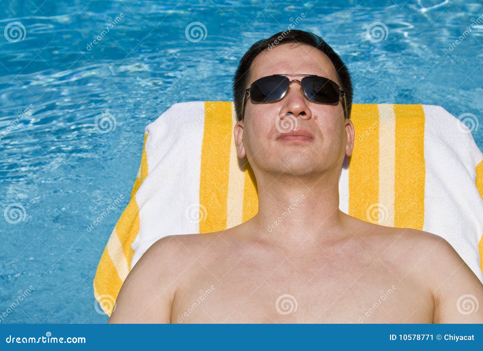 Man Lounging by the Pool stock image. Image of home, sunglasses - 10578771